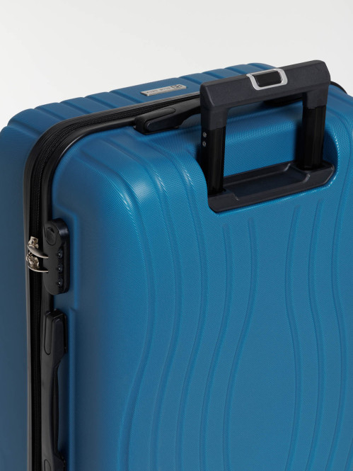 Valise rigide bleue à roulettes